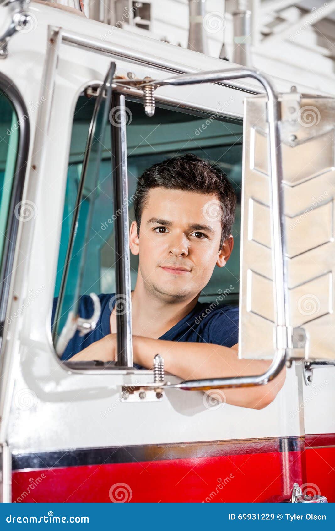 Confident Young Fireman Sitting in Firetruck Stock Image - Image of ...