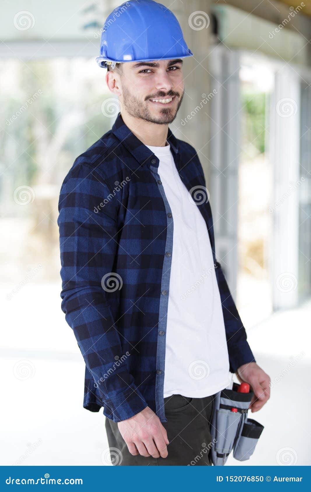 Confident Young Male Builder Posing Indoors Stock Photo - Image of ...