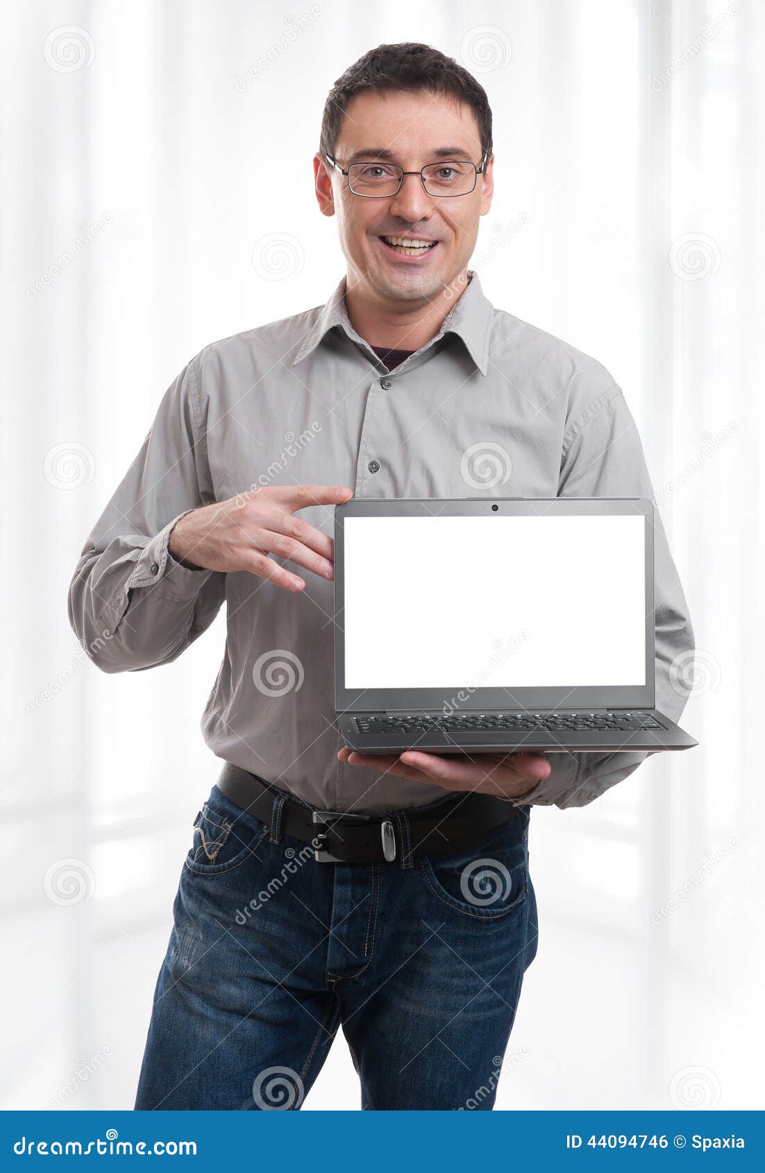 Confident Young Man Advertising Laptop Stock Photo - Image of ...