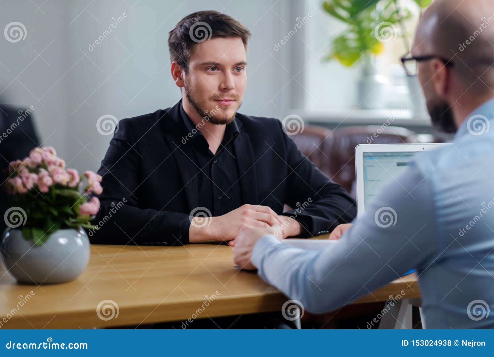 Confident Young Man Attending Job Interview Stock Photo - Image of ...