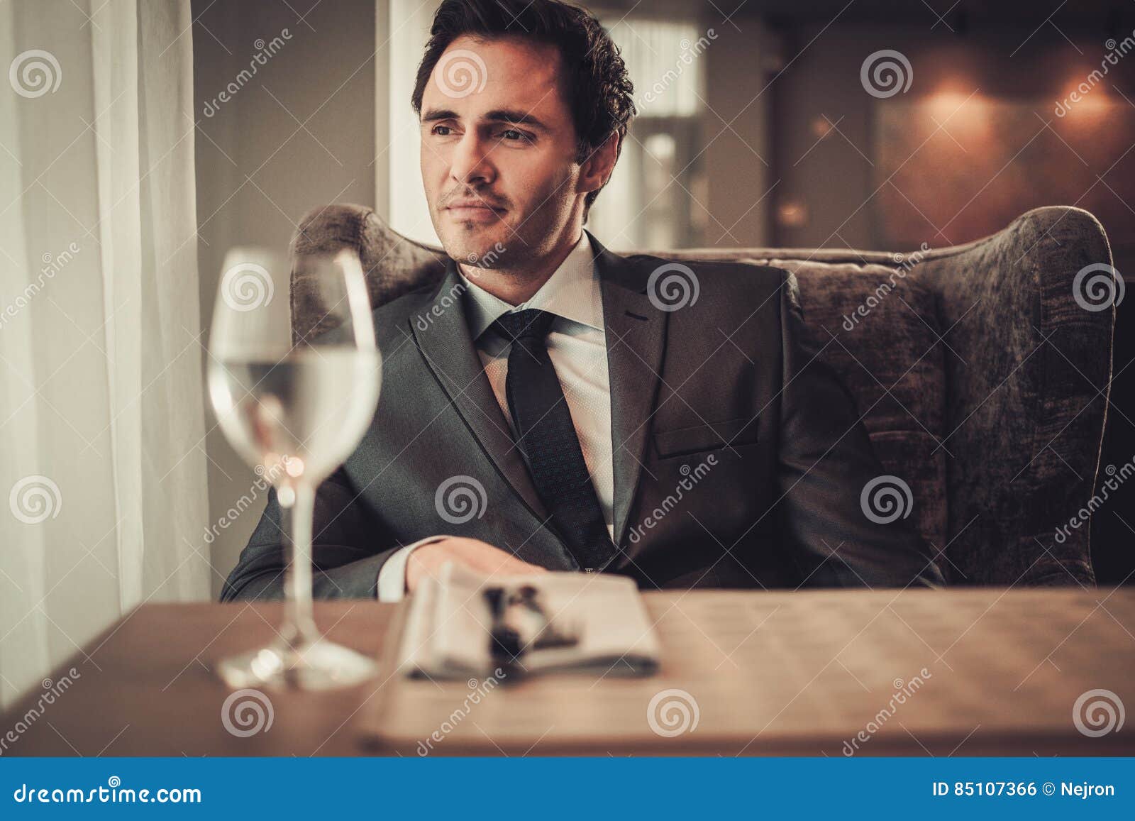 Confident Young Man Sitting in Restaurant Waiting for Somebody Stock ...