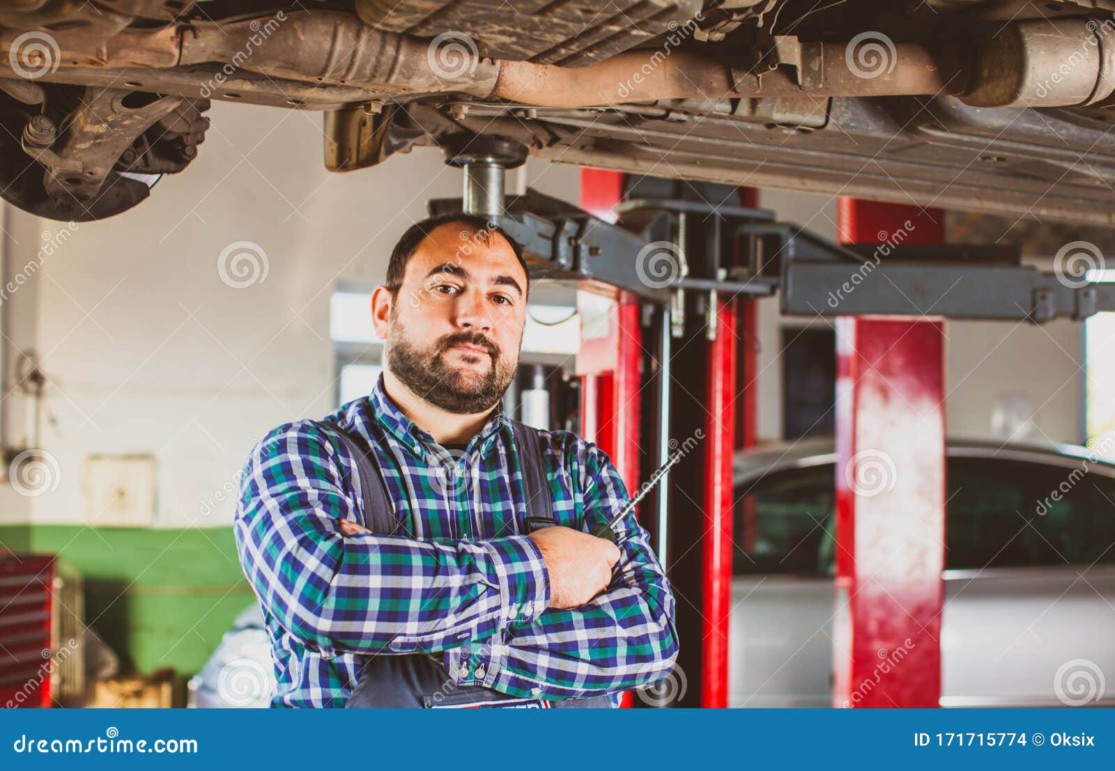 Confident Young Mechanic in a Car Service Stock Photo - Image of ...