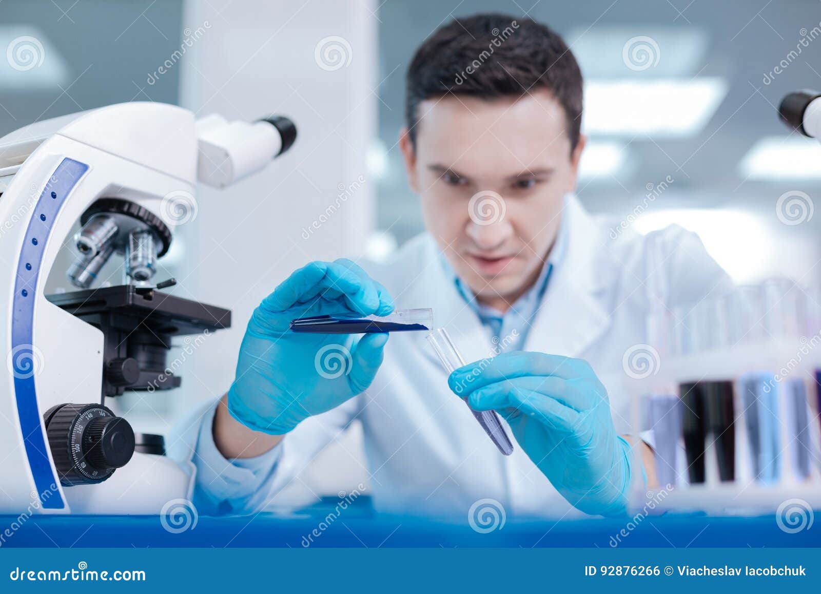 Confident Young Practitioner Doing Analysis Stock Photo - Image of ...