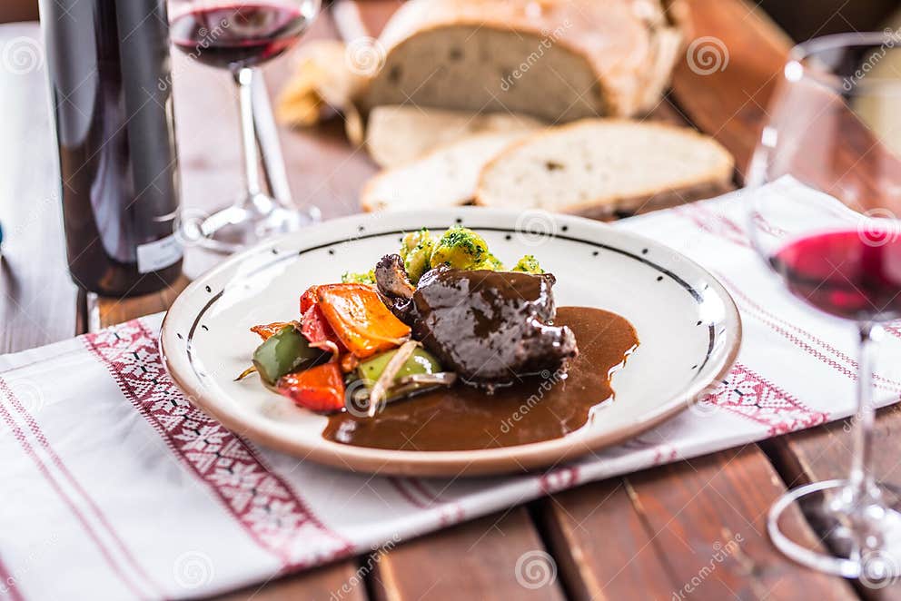 Confit Rabbit Leg with Vegetable Bread Redvine in Pub or Restaur Stock ...