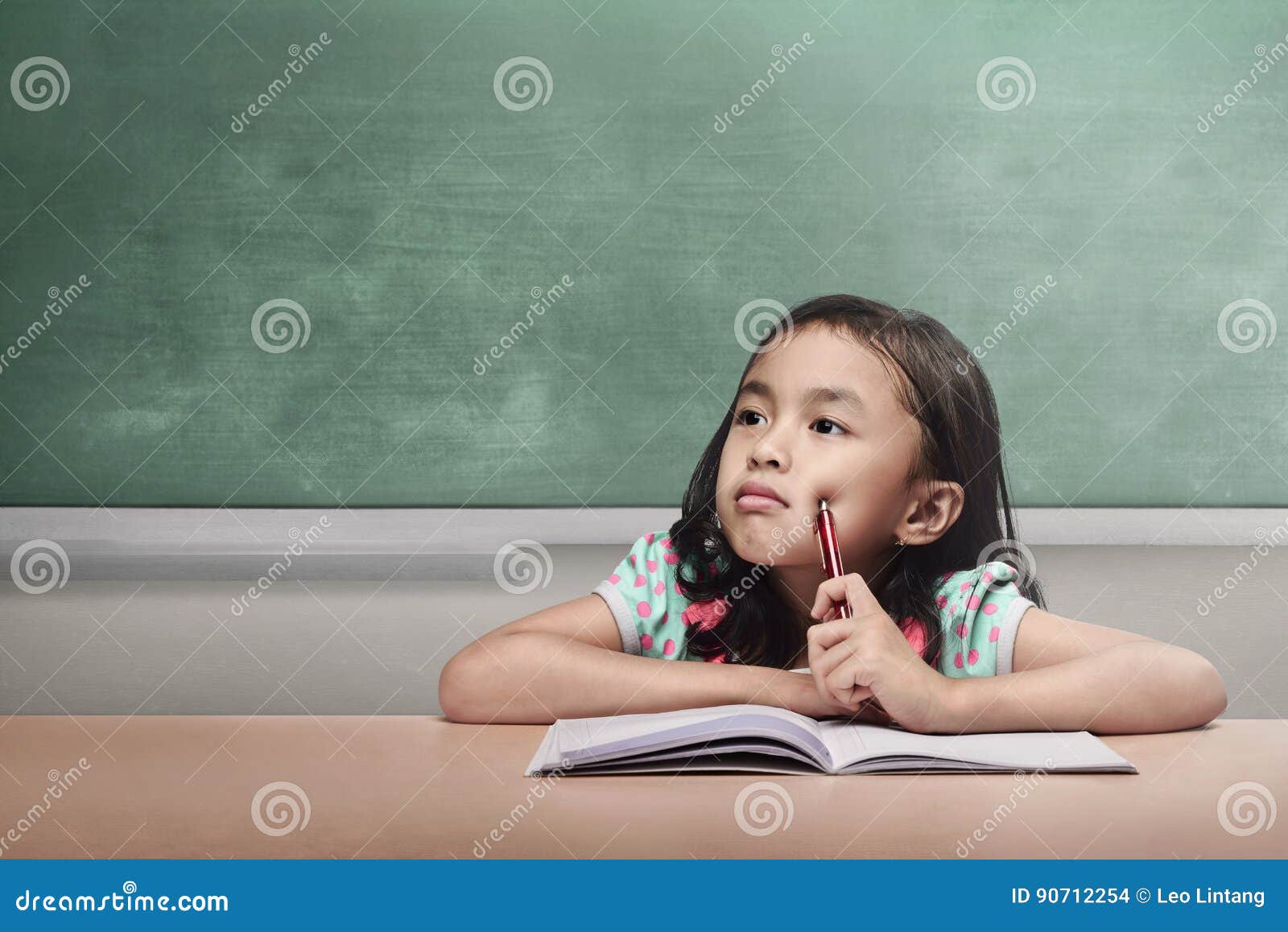 Confused Asian Girl with Book and Pen Doing Her Task Stock Photo ...