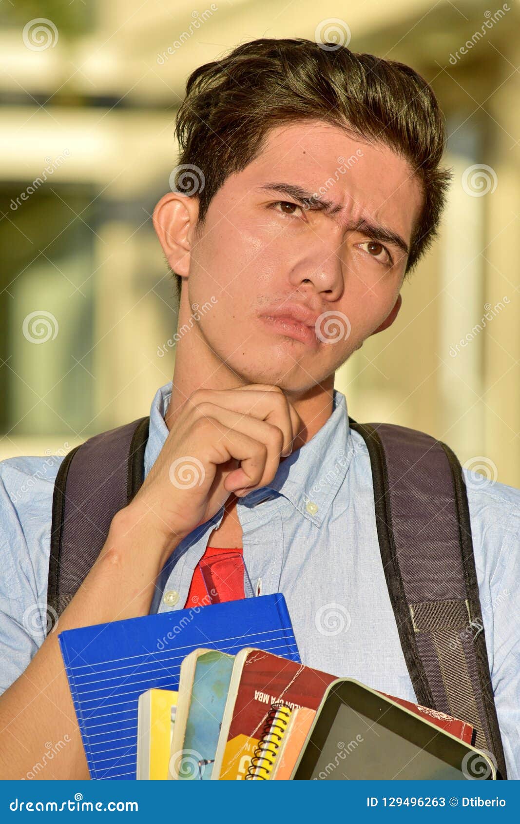 Confused Boy Student with Books Stock Image - Image of unsure ...