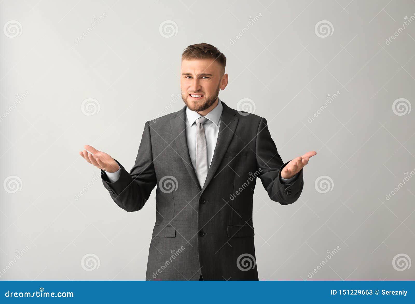 Confused Businessman on Grey Background Stock Image - Image of male ...
