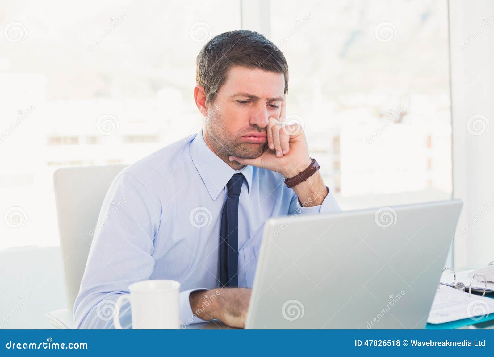 Confused Businessman Looking at His Laptop Stock Photo - Image of ...