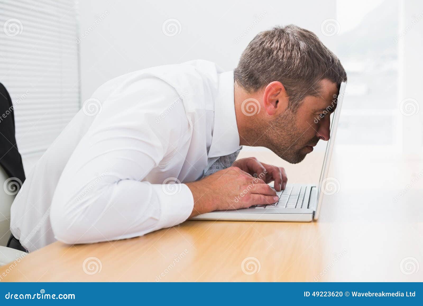 Confused Businessman Looking at His Laptop Stock Photo - Image of ...
