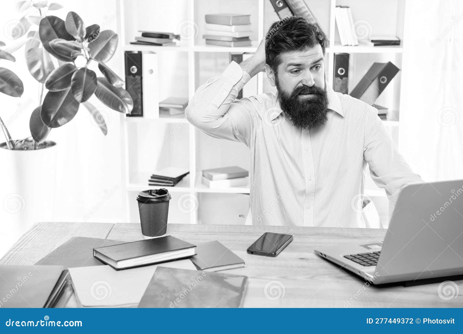 Confused Businessman Scratching Head while Working at Laptop in Office ...