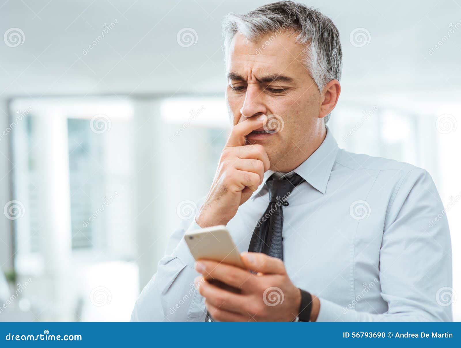 Confused Businessman Using a Smart Phone Stock Photo - Image of formal ...