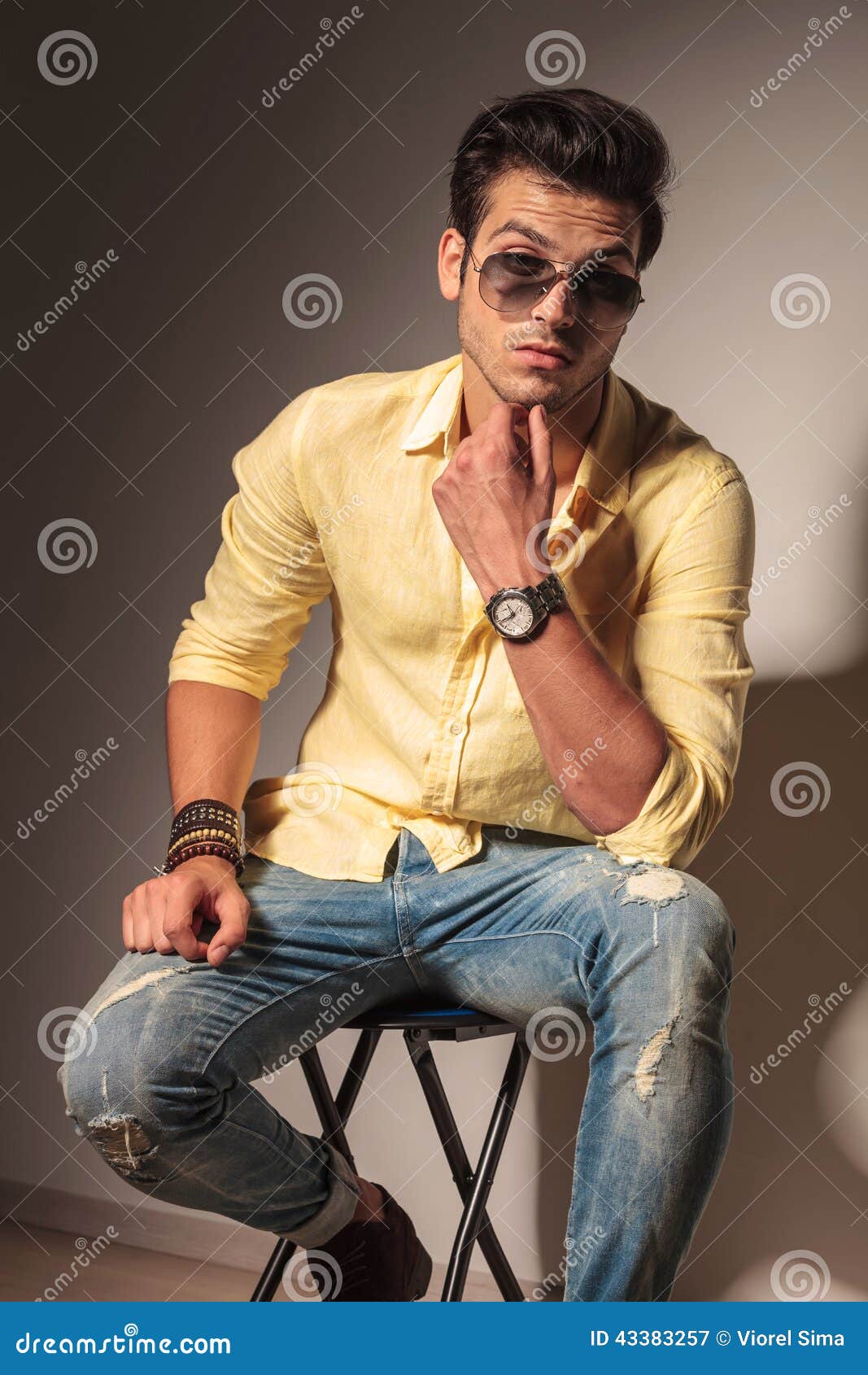 Confused Casual Man Looking At The Wallpaper He Is Holding Royalty-Free ...