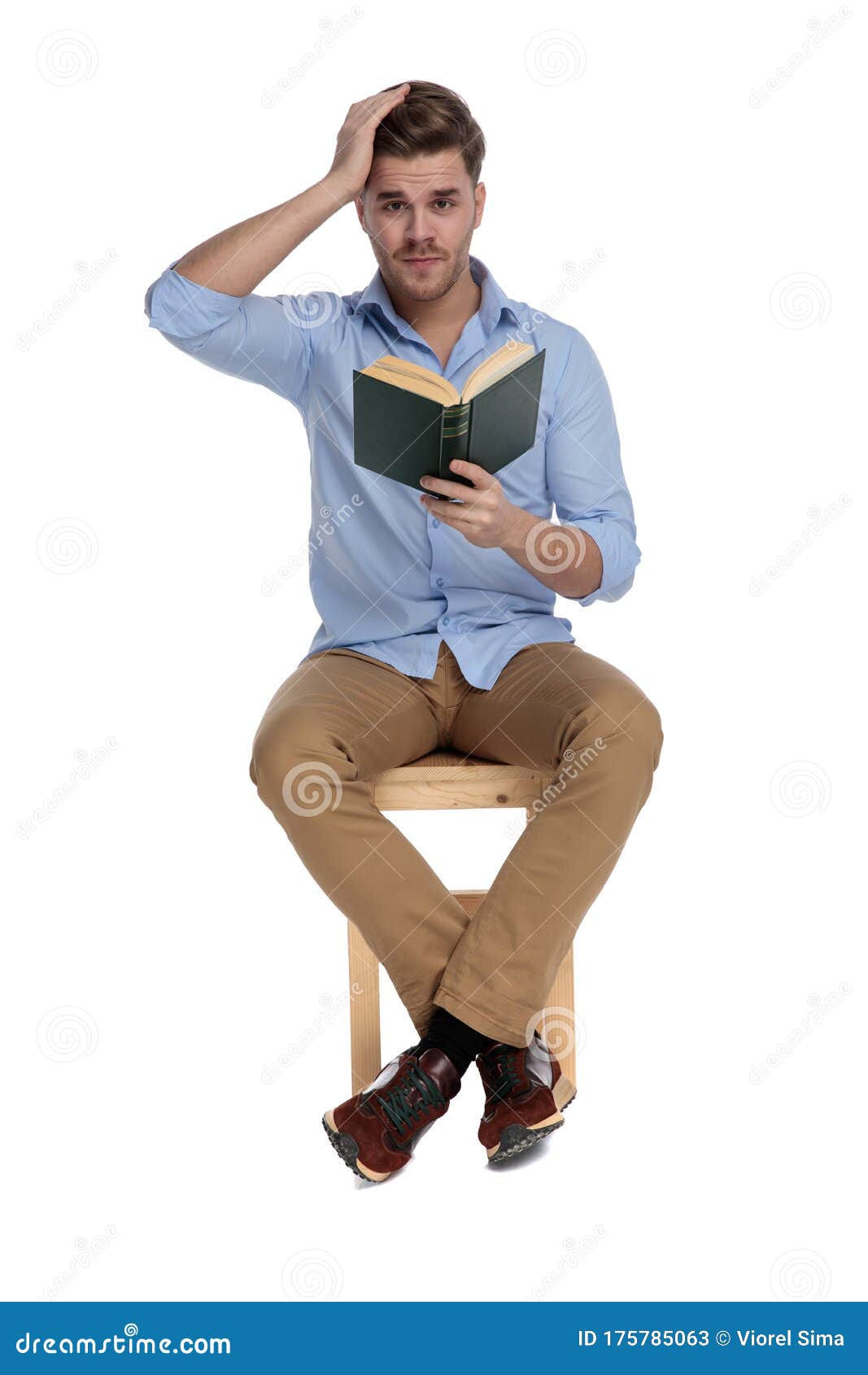 Confused Casual Man Looking At The Wallpaper He Is Holding Royalty-Free ...