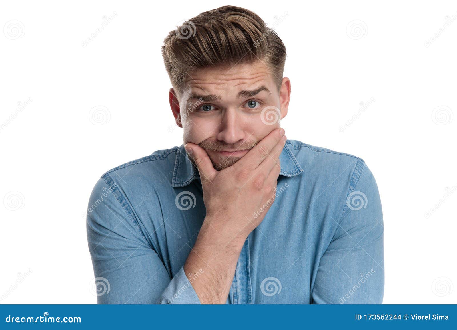 Confused Casual Man Looking At The Wallpaper He Is Holding Royalty-Free ...