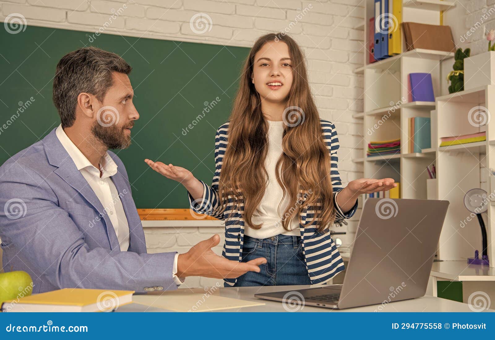 Confused Child with Man Teacher in Classroom. Education Stock Photo ...