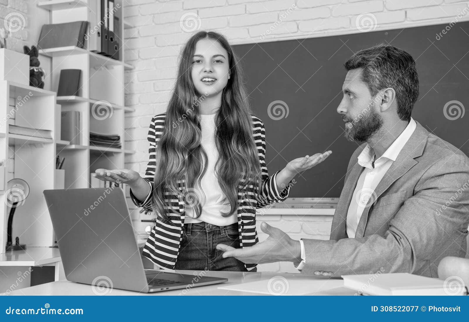 Confused Child with Man Teacher in Classroom. Education Stock Image ...