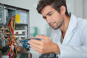 Confused Computer Repair Man Stock Image - Image of professional ...