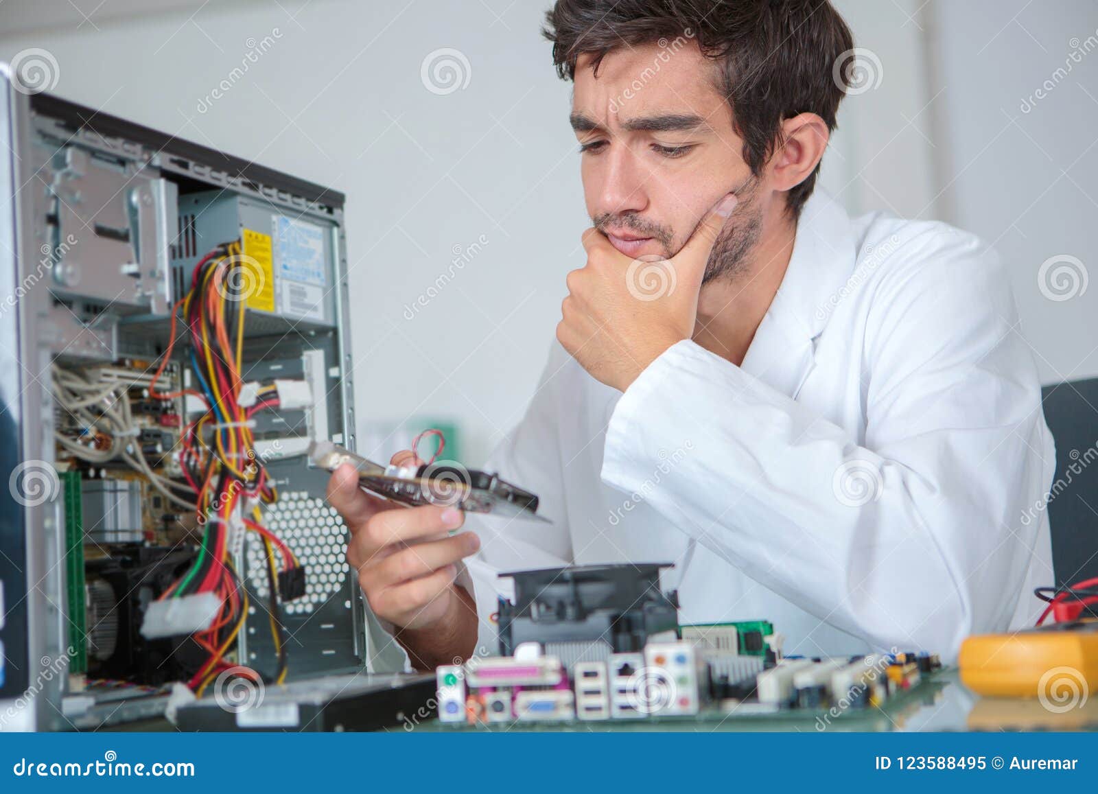 Confused Computer Technician Studying Component Stock Image - Image of ...