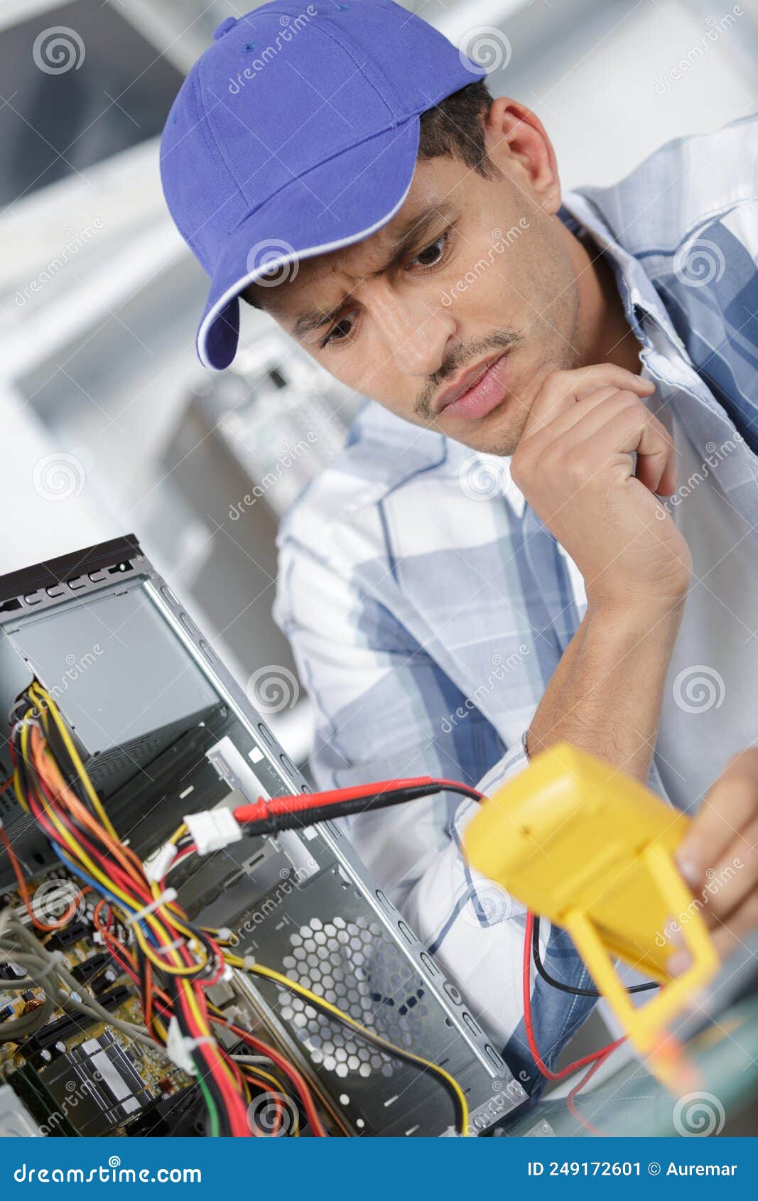 Confused Computer Technician Using Multimeter Stock Image - Image of ...