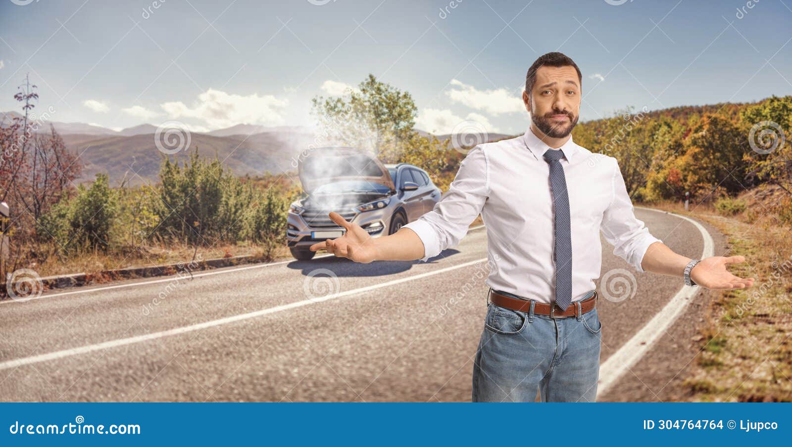 Confused Driver Standing on a Road in Front of a Broken Down Car Stock ...