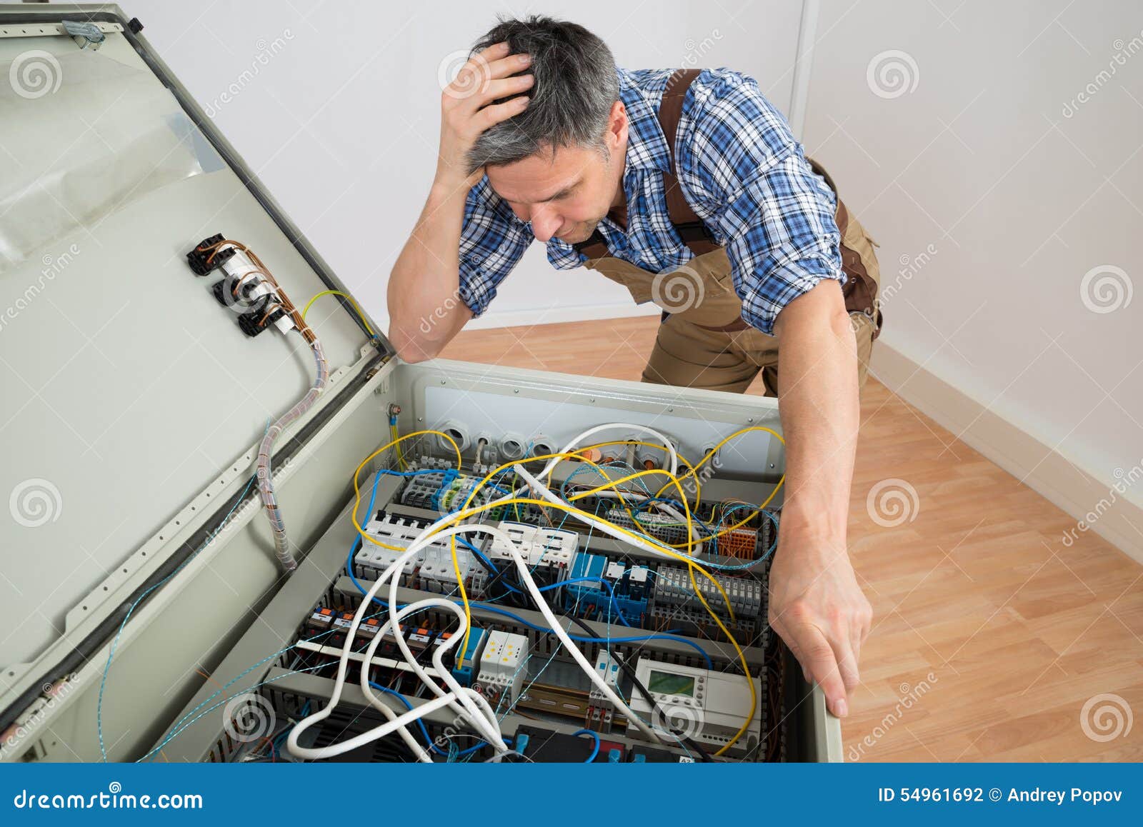 Confused Electrician Looking at Fuse Box Stock Photo - Image of ...