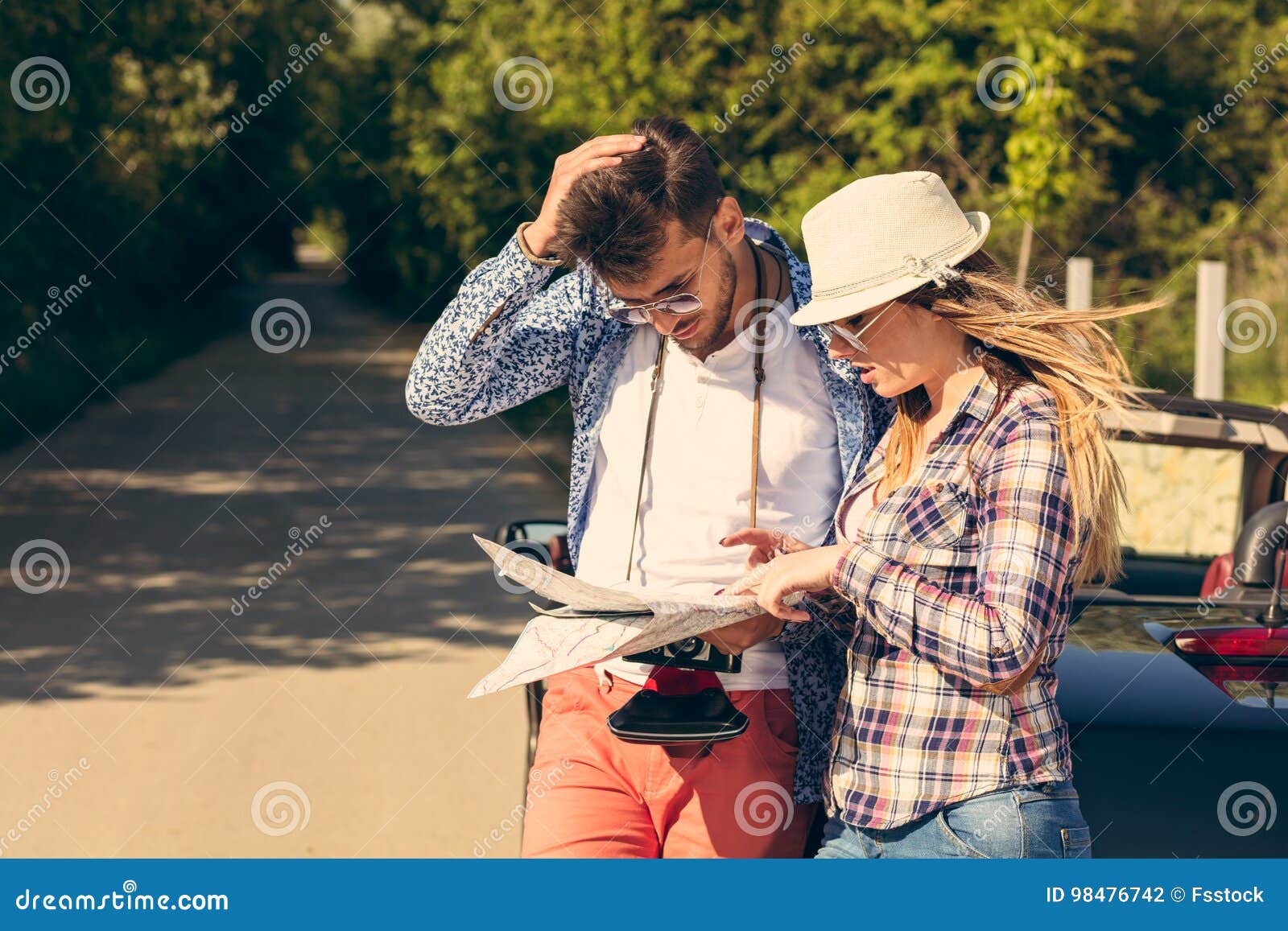 Confused Friends with Map Looking at the Map at Cabriolet Car Stock ...