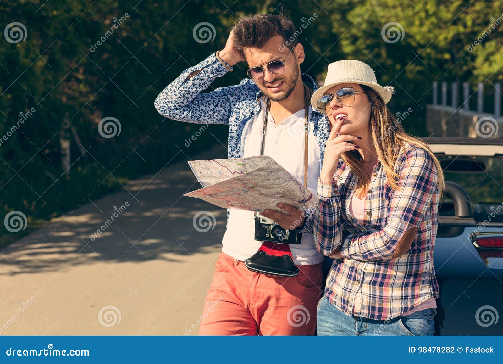 Confused Friends with Map Looking at the Map at Cabriolet Car Stock ...