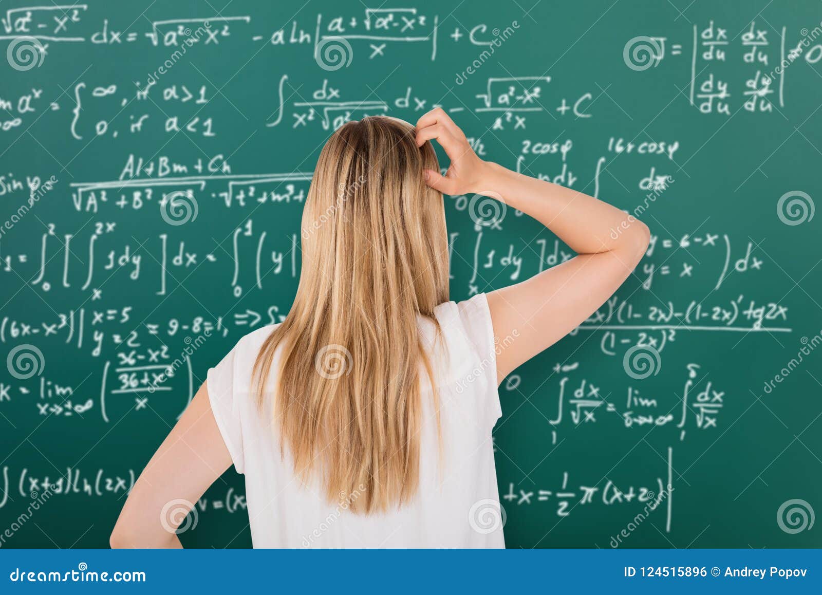 Confused Girl Looking at Blackboard in Classroom Stock Photo - Image of ...