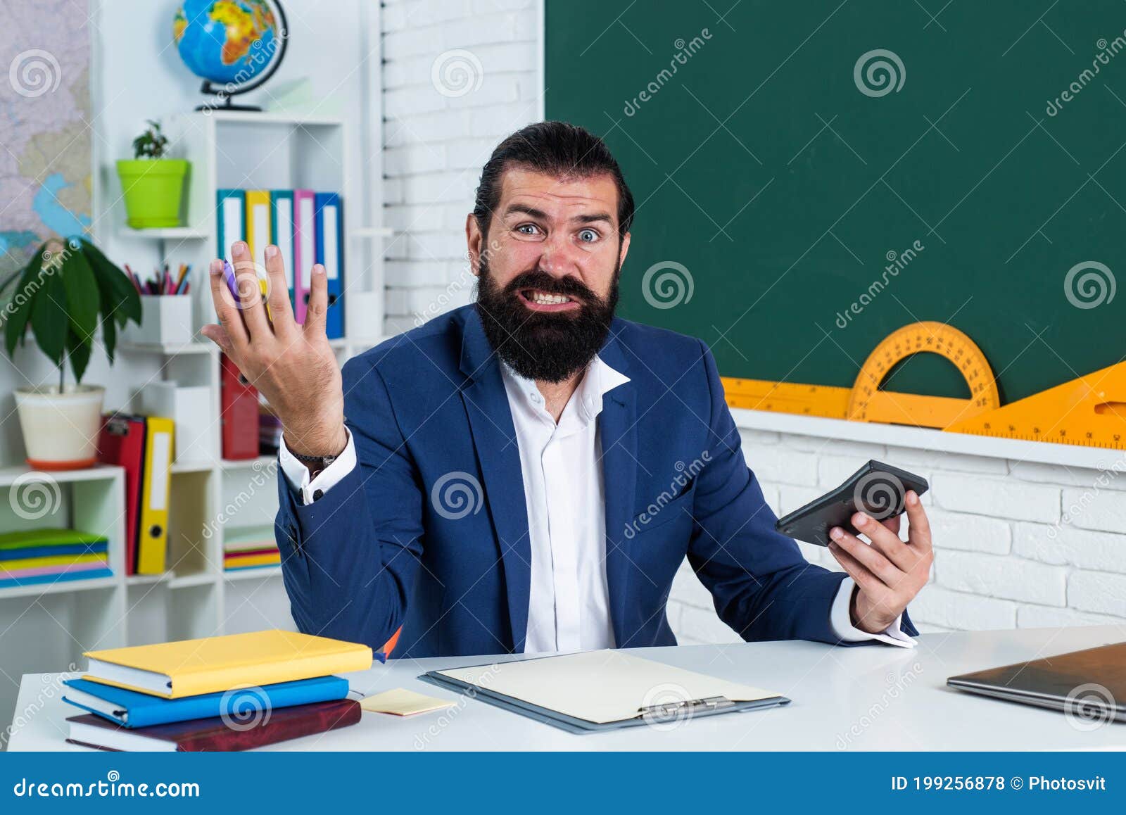 Confused Guy with Beard Calculating on Calculator in School Math Lesson ... Confused Guy with Beard Calculating on Calculator in School Math Lesson ...