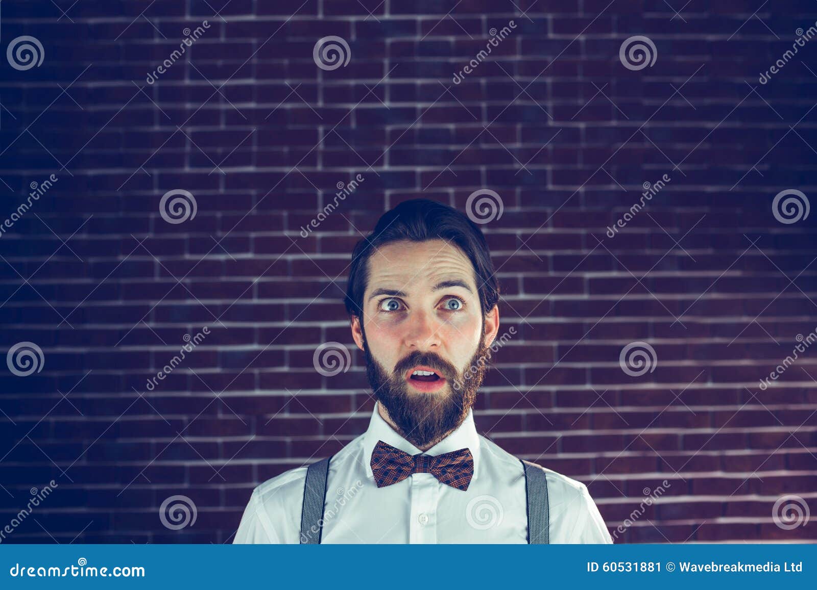 Confused Handsome Young Man In Blue Shirt Smiling And Looking At ...