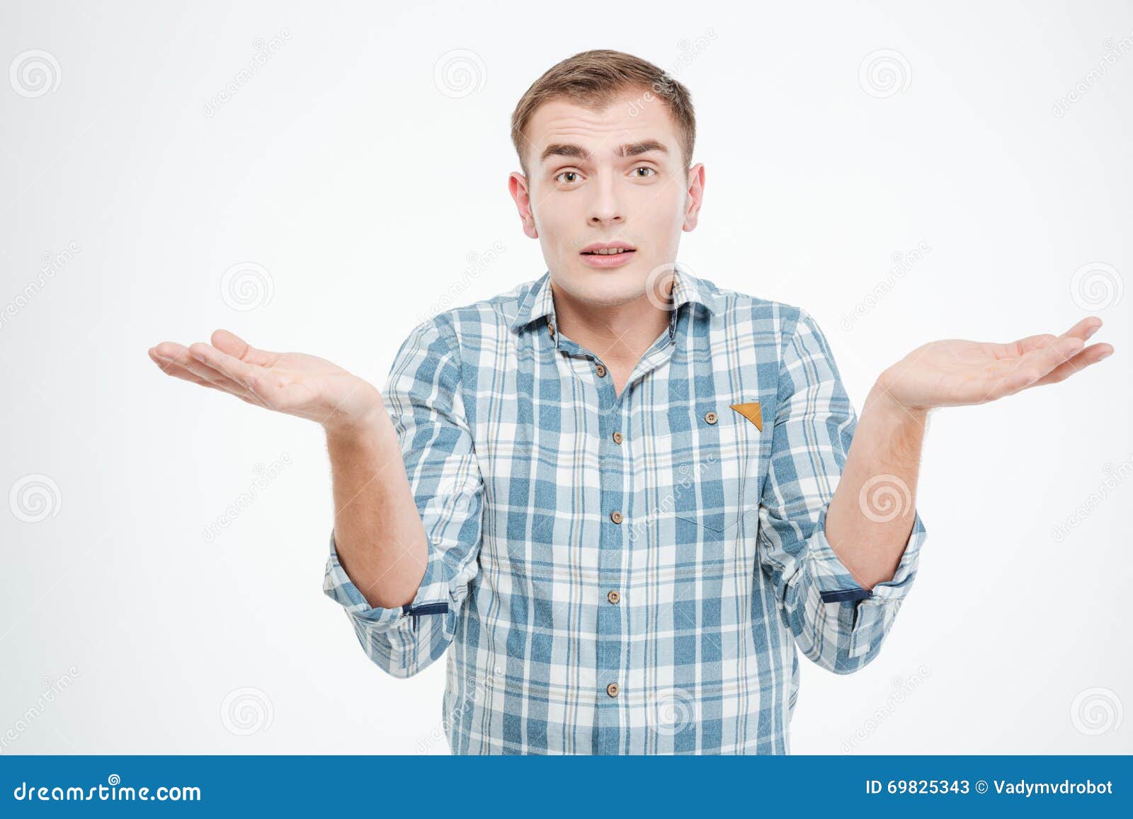 Confused Handsome Young Man In Blue Shirt Smiling And Looking At ...