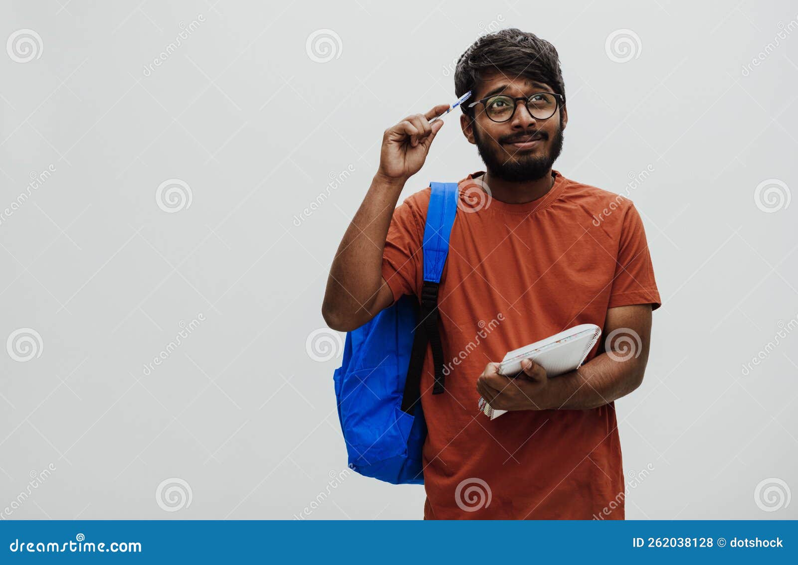 Confused Indian Student with Blue Backpack, Glasses and Notebook Posing ...