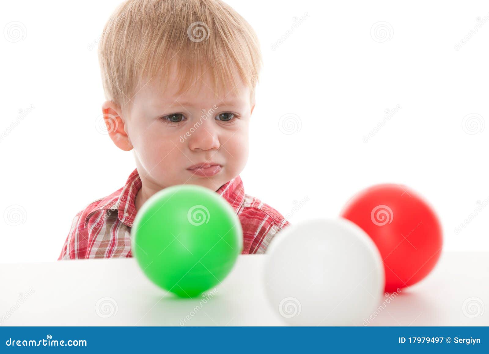 Confused Kid Looking at Balls Stock Image - Image of cute, alone: 17979497
