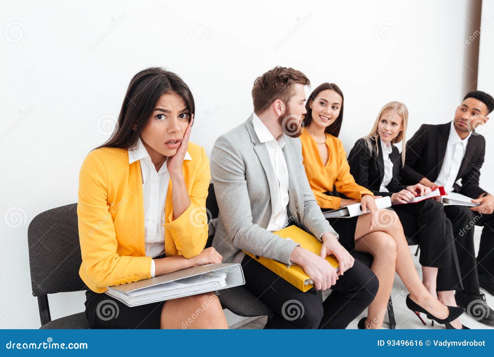 Confused Lady Sitting Near Colleagues in Office Stock Photo - Image of ...