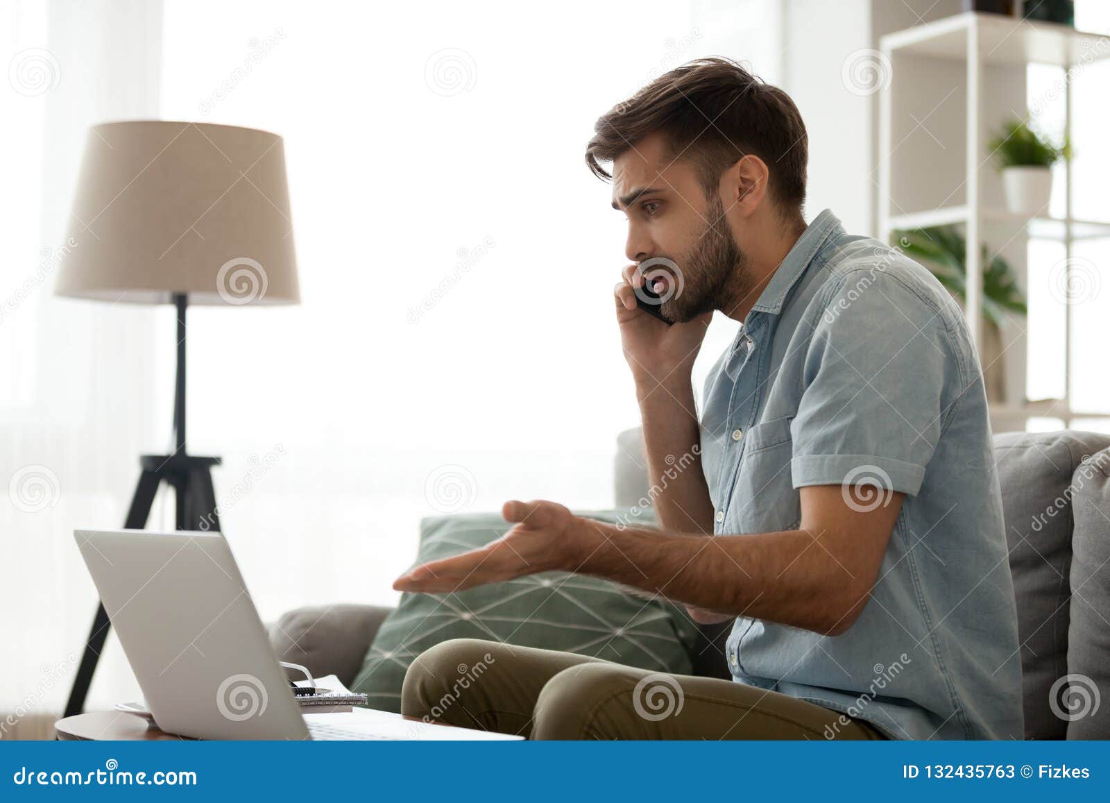Confused Male Speak on Phone Solving Laptop Operational Problems Stock ...