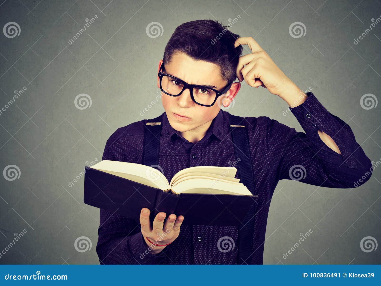 Confused Man in Glasses Perplexed after Reading a Book Stock Image ...