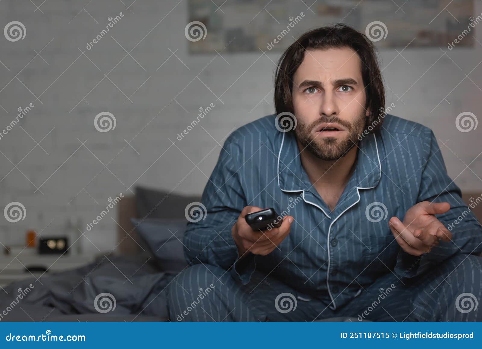 Confused Man with Insomnia Holding Remote Stock Image - Image of blur ...