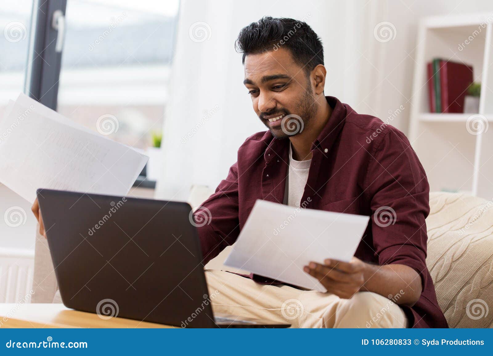 Confused Man with Laptop and Papers at Home Stock Image - Image of ...