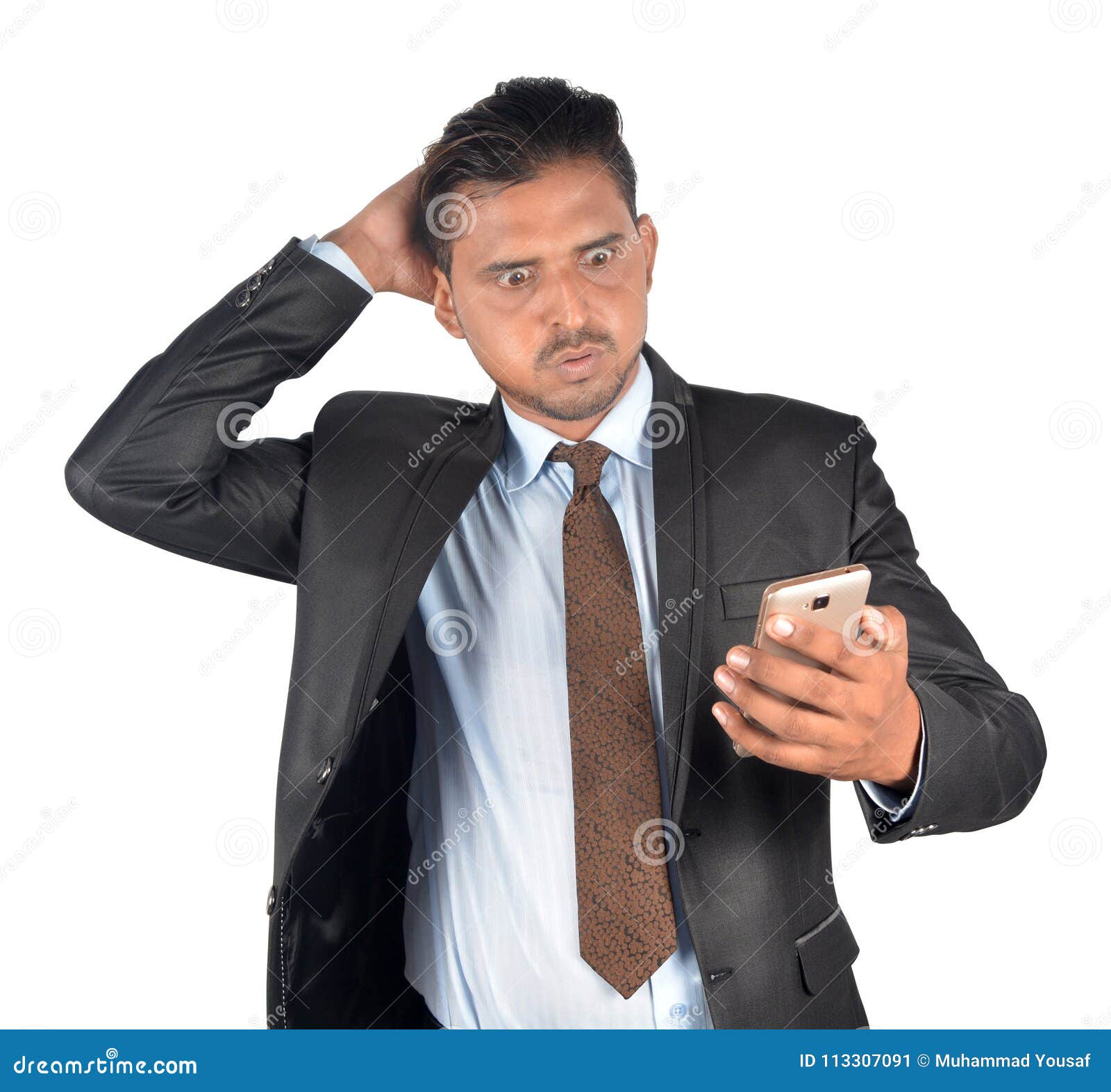 Confused Man Looking At Android Phone Professionally Isolated On Stock
