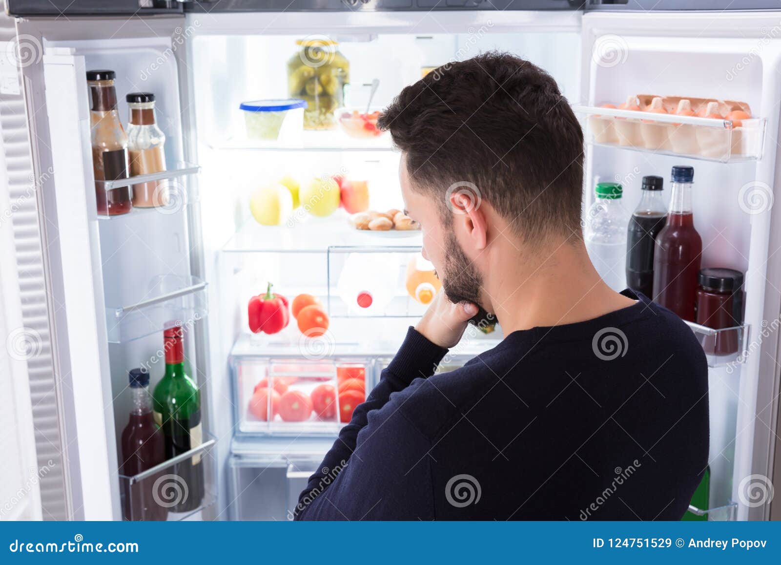 Confused Man Looking at Food in Refrigerator Stock Image - Image of ... Confused Man Looking at Food in Refrigerator Stock Image - Image of ...