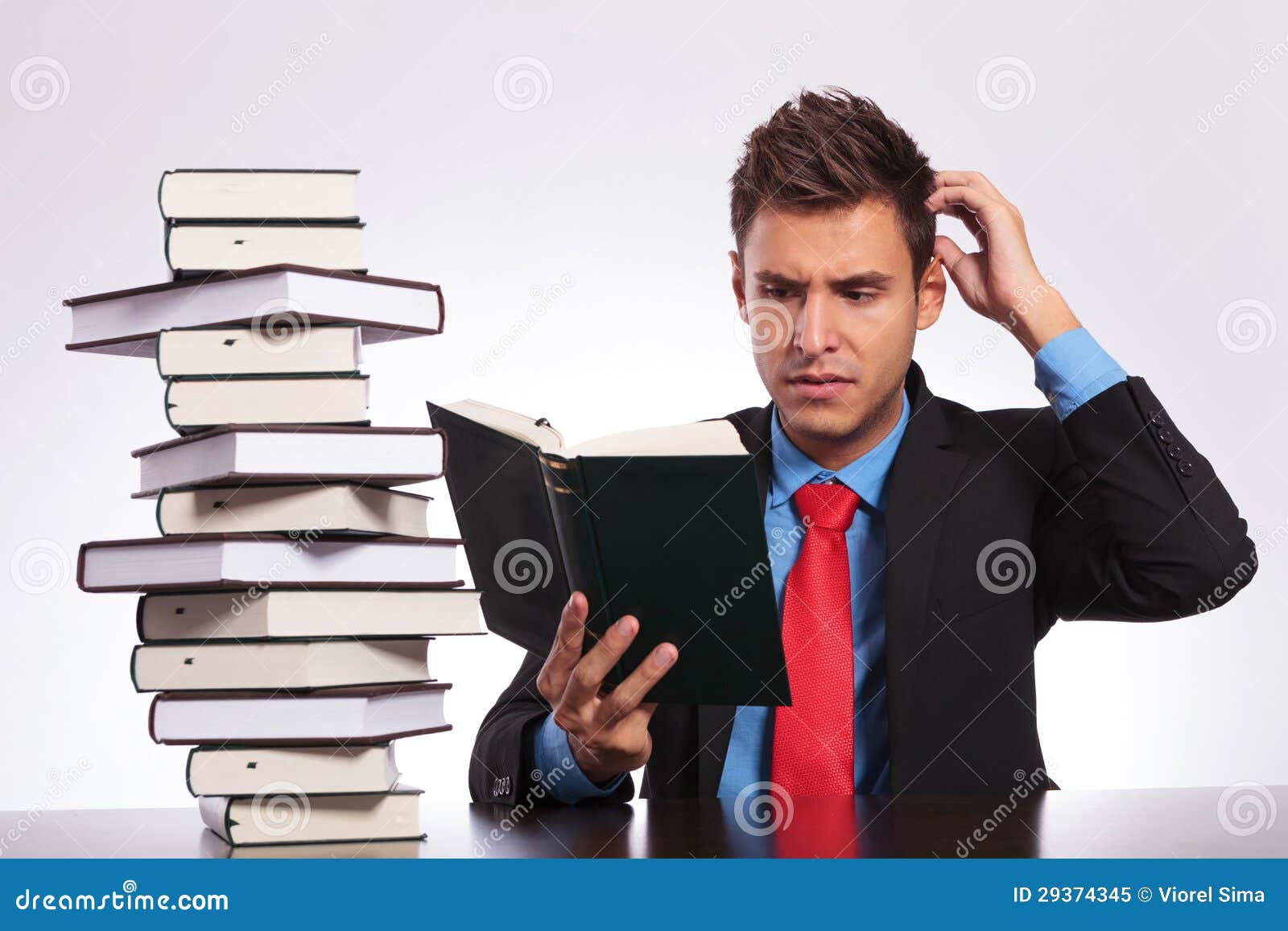 Confused Man Reading at Desk Stock Image - Image of professional ...