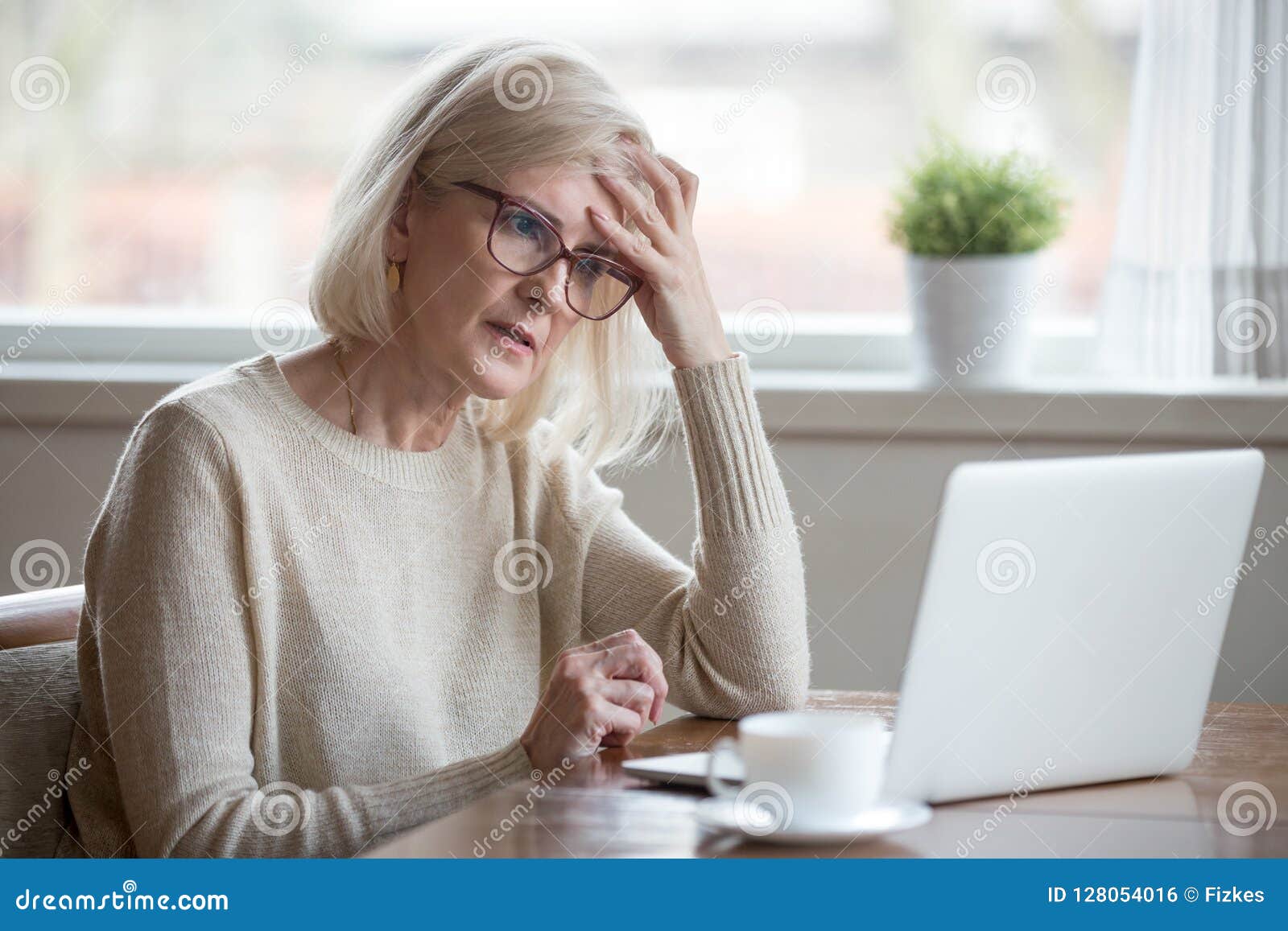 Confused Mature Woman Thinking about Online Problem Looking at L Stock ... Confused Mature Woman Thinking about Online Problem Looking at L Stock ...