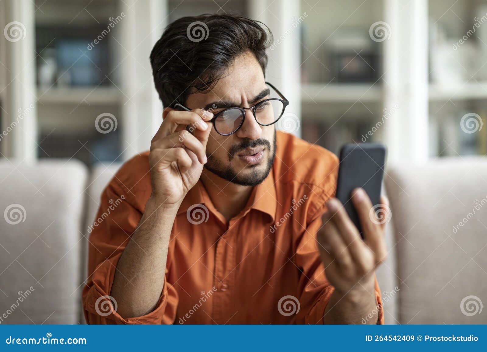 Confused Arab Man Feeling Shocked Received Bad Message On Cellphone