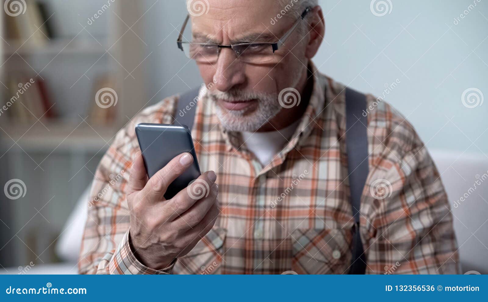 Confused Old Man Looking at Cellphone, New Technology Complicated for ... Confused Old Man Looking at Cellphone, New Technology Complicated for ...