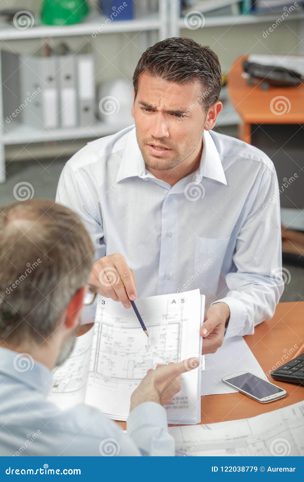 Confused Apprentice Electrician Looking At Fusebox Stock Image ...