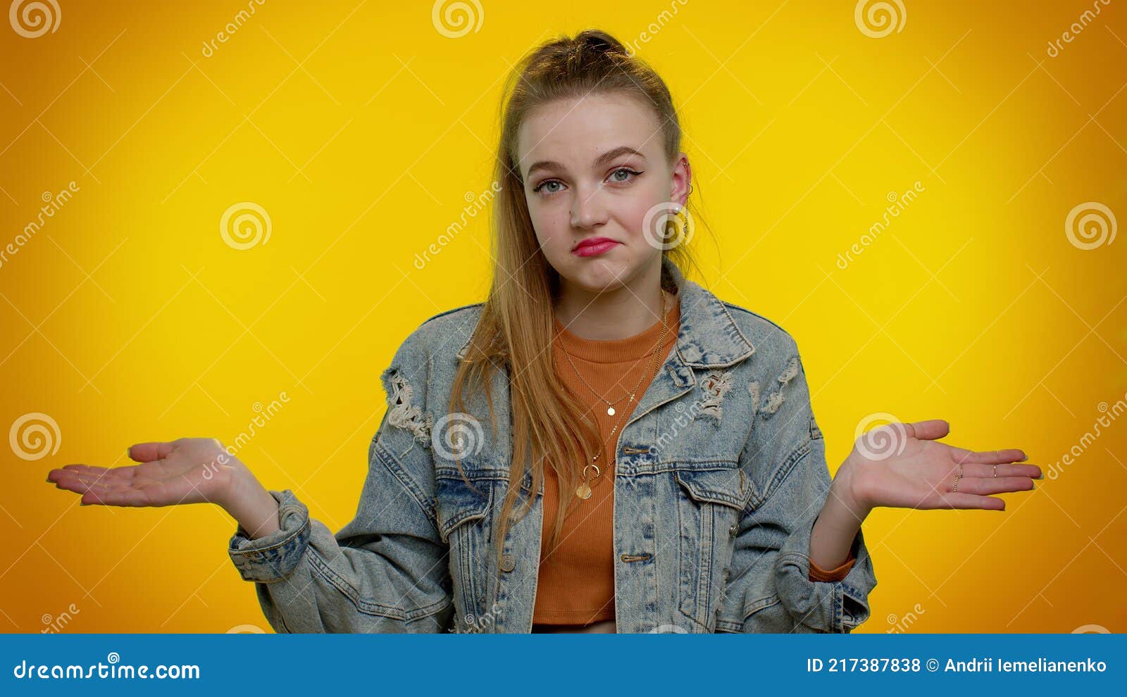 Clueless Teen Girl Shrugs Shoulders Smiles Nervously Saying Sorry