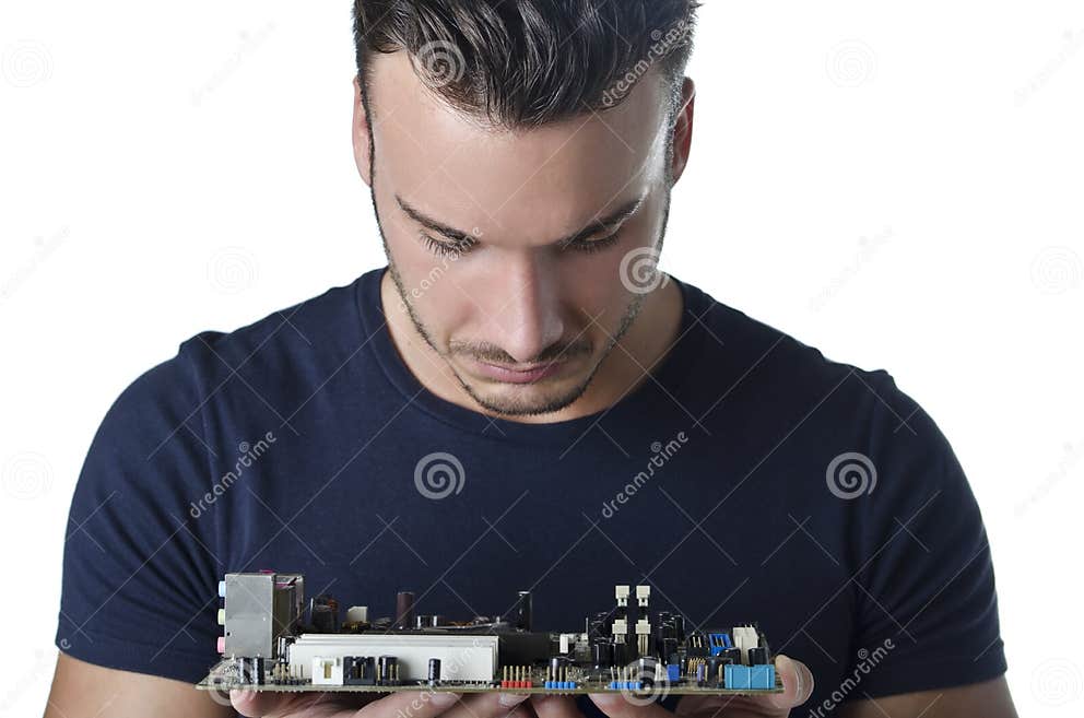 Confused, Puzzled Computer Technician Looking at Motherboard Stock ...