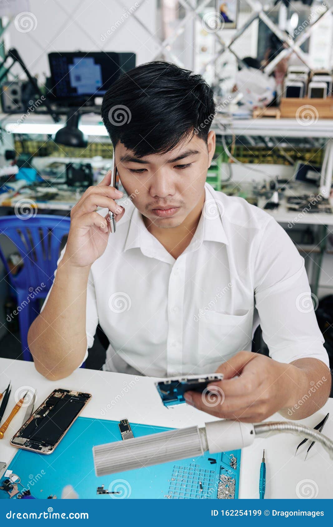 Confused Repairman Calling Coworker Stock Image - Image of installing ...