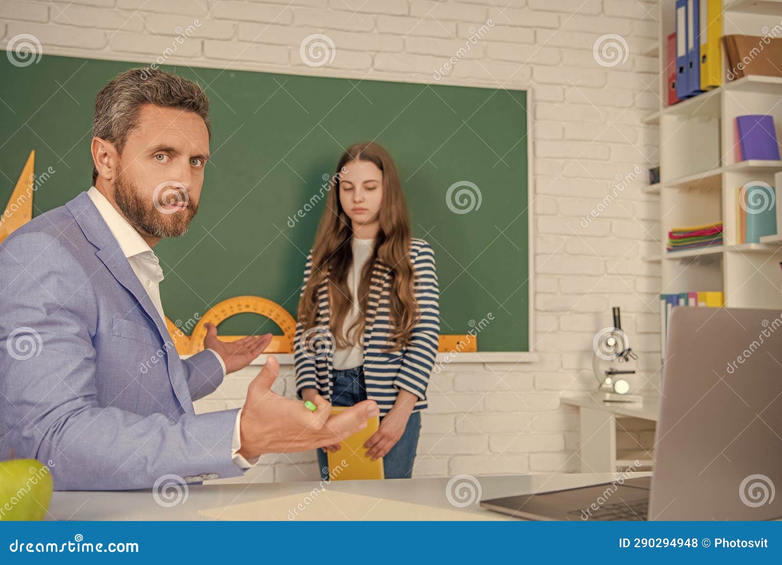Confused School Teacher with Selective Focus of Child at Blackboard ...