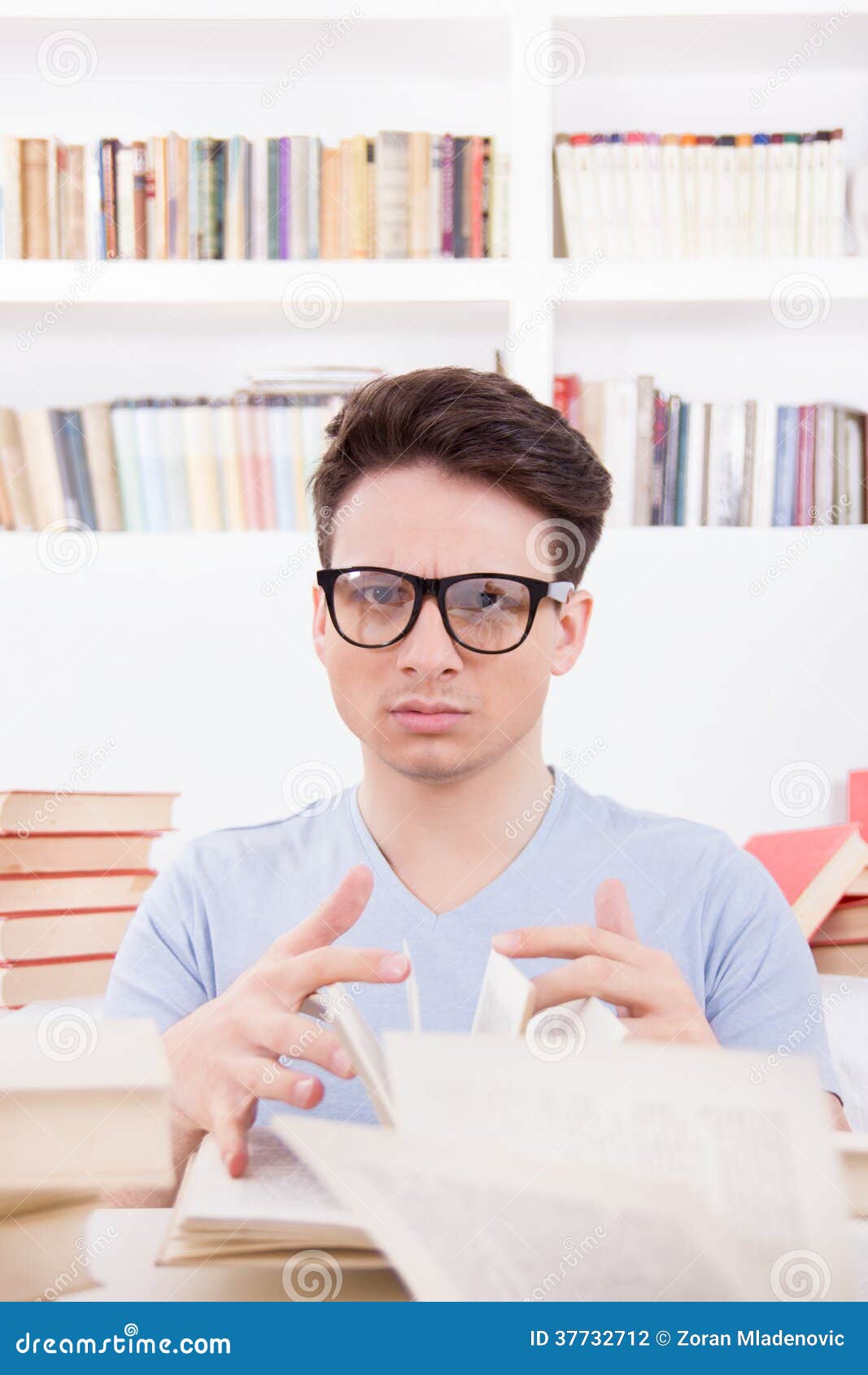 Confused Male Student Reading Many Books For Exam Royalty-Free Stock ...